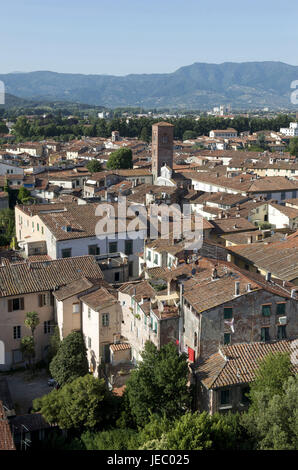 Europe, Italy, Lucca. View of outside religious artwork on top wall of ...