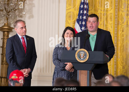 Sergeant Michael Verardo (right) speaks with his wife Sarah Verardo at ...