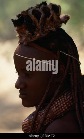Himba woman wearing traditional dress with her skin covered in Otjize ...