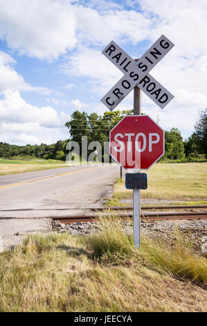 Rail road crossing signs stop warning lights exit Stock Photo - Alamy