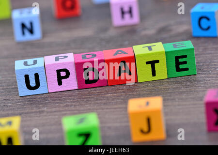 Update word on wooden table Stock Photo - Alamy