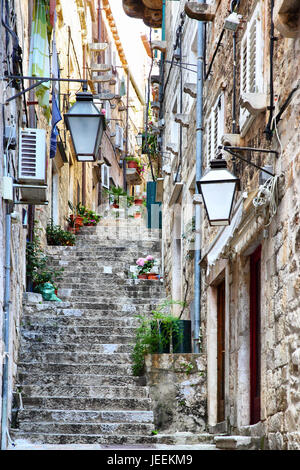 Uphill street with colorful building Stock Photo - Alamy
