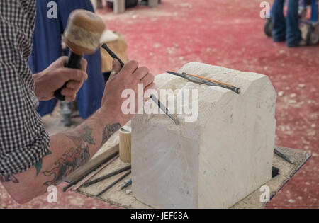 Stonemason demonstrating traditional skills at a heritage and craft ...