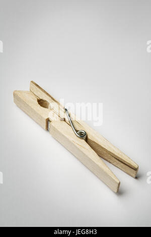 single wooden clothes peg on white background Stock Photo - Alamy