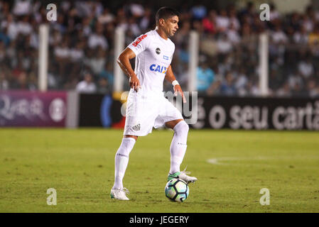 Santos, Brazil. 24th June, 2017. Diego Souza is scored by Thiago Maia ...