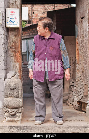 BEIJING-SEPT. 28, 2007. Elderly inhabitant of Beijing hutong. Hutongs ...