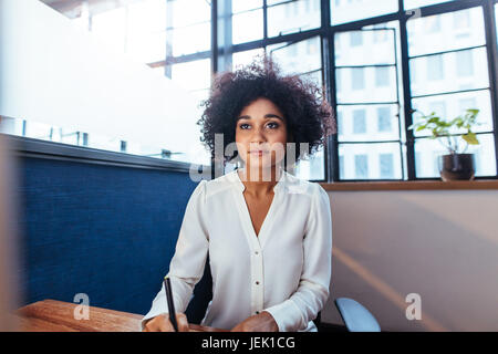 Female executive working on computer at desk Stock Photo - Alamy