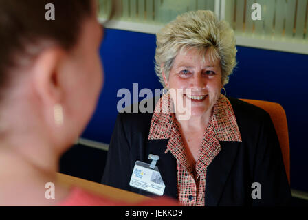 A receptionist in a NHS (National Health Service) East Quay Medical ...