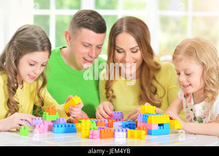 Family collecting blocks together Stock Photo - Alamy