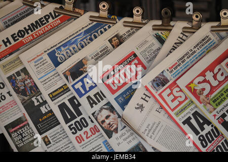 Greek newspapers on a clothesline in a newspapers shop of Athens ...