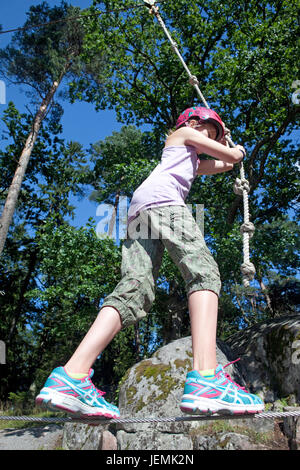Girls when balancing on a tightrope Stock Photo - Alamy