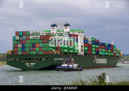 A container ship, right, and a cargo vessel are seen in the Strait of ...