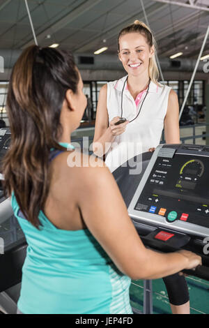 Trainer using stopwatch Stock Photo - Alamy
