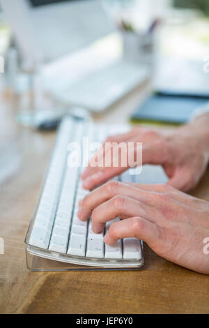 Masculine hands typing Stock Photo - Alamy
