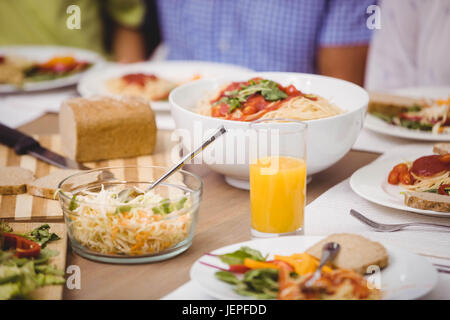 Variety of meals on dining table Stock Photo - Alamy