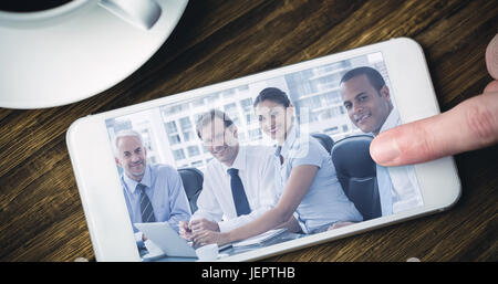 Composite image of smartphone on desk Stock Photo - Alamy
