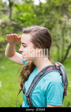 Woman observing something Stock Photo - Alamy