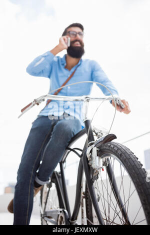 Hipster calling someone Stock Photo - Alamy