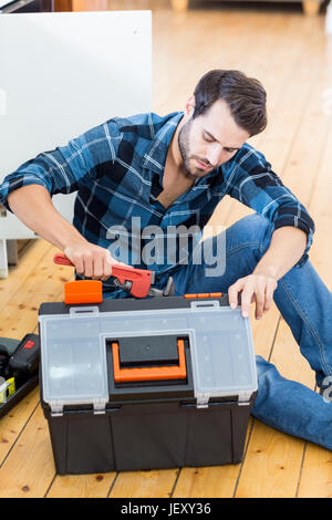 Man unpacking his tool box Stock Photo - Alamy