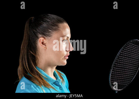 Female athlete holding badminton racket Stock Photo - Alamy