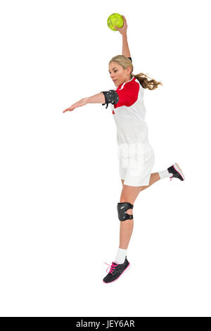 Sportswoman throwing a ball Stock Photo - Alamy