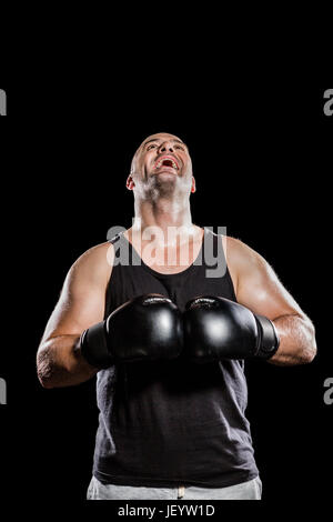 Boxer in boxing gloves laughing Stock Photo - Alamy