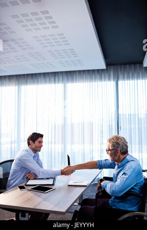 businessmen giving a handshake Stock Photo - Alamy