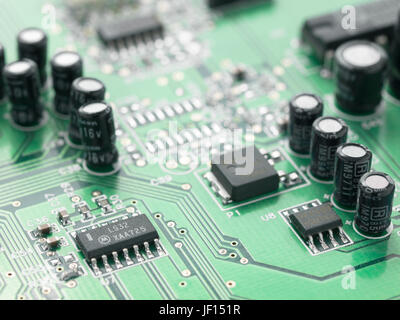 Close shot of computer mother board showing back up battery in place ...