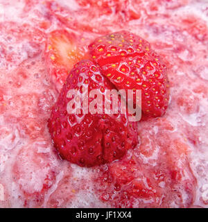 Strawberry puree, decorated with fresh strawberries Stock Photo - Alamy