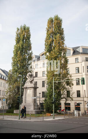 the statue of goddess athena on a tall corinthian pillar in front of ...