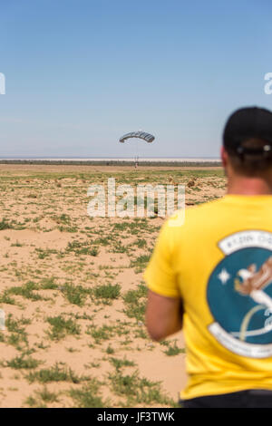 Trever Bush, 412th OSS Parachute Test Team, demonstrates the operation ...