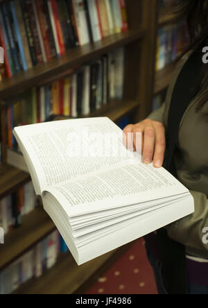 Open book in a bookstore Stock Photo - Alamy