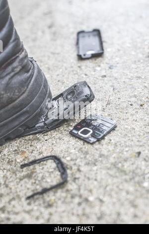Old broken mobile phone. Boot crease phone Stock Photo - Alamy