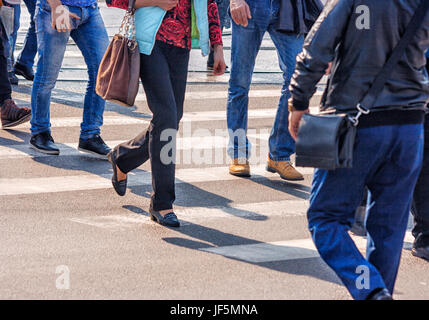 crossroad with walking pedestrians on sunny spring day Stock Photo - Alamy