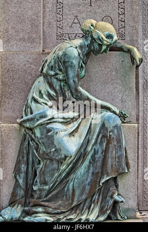 Cemetery with a sad man statue on the foreground. religion Stock Photo ...