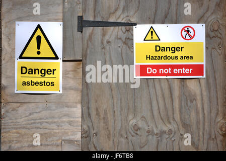 Danger Asbestos sign on a condemned building Stock Photo - Alamy