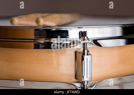 Close-up of a snare drum, percussion instrument on a dark background ...