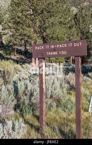 A sign warning hikers to Pack it in Pack it Out, meaning whatever ...