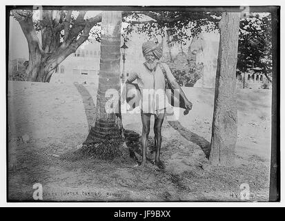 Bhisti (Water Carrier) Bombay, Photograph shows a water carrier in ...