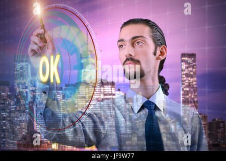 Businessman pressing virtual button OK Stock Photo - Alamy