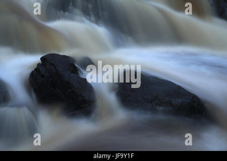 Water Splashing Between Stones in Waterfall Stock Photo - Alamy