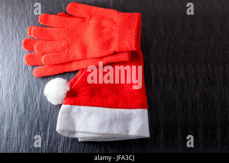 Santa's hat and red gloves Stock Photo - Alamy