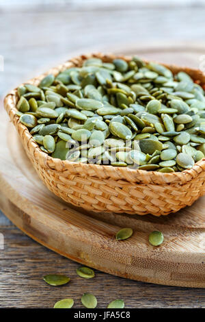 Fresh green pumpkin peeled seeds in the bowl Stock Photo - Alamy