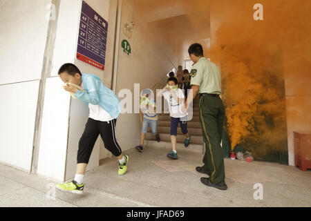 Haimen, China's Jiangsu Province. 30th June, 2017. A staff member from ...