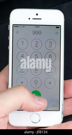 PICTURE POSED BY MODEL A person dials the '999' Emergency number on a ...