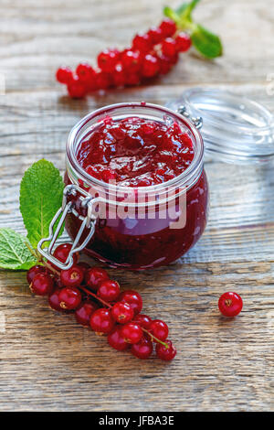 Red berry jam in a jar on table, natural organic product - homemade ...