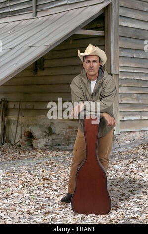 Western country cowboy musician with guitar, black and white portrait ...