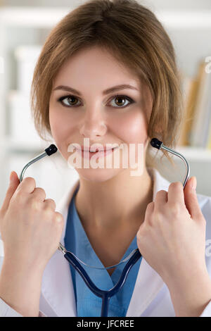 Doctor holds stethoscope head, closeup. Physician ready to examine and ...
