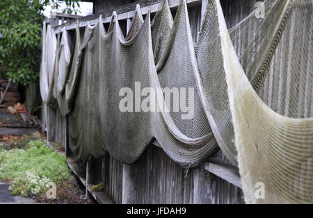 Fishing nets drying on fence in Fishing village in the Netherlands ...
