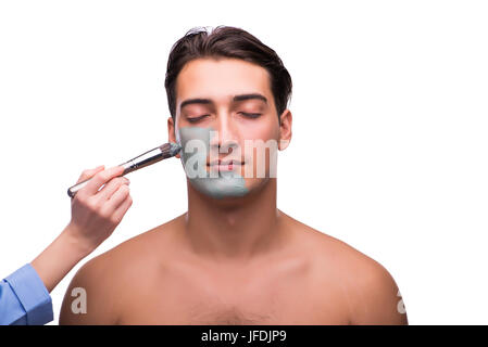 Man with face mask being applied on white Stock Photo - Alamy
